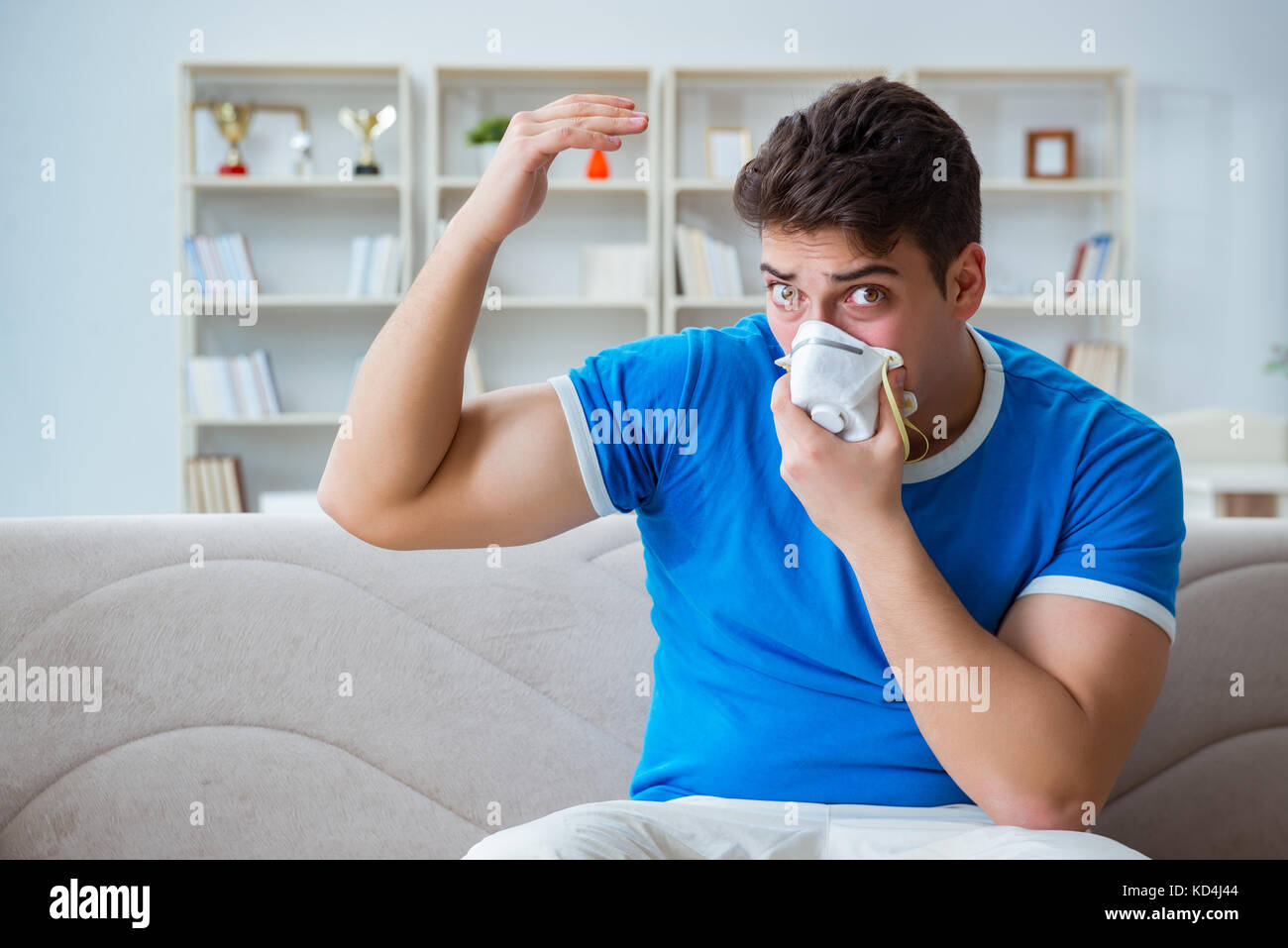 Man sweating excessively smelling bad at home Stock Photo - Alamy