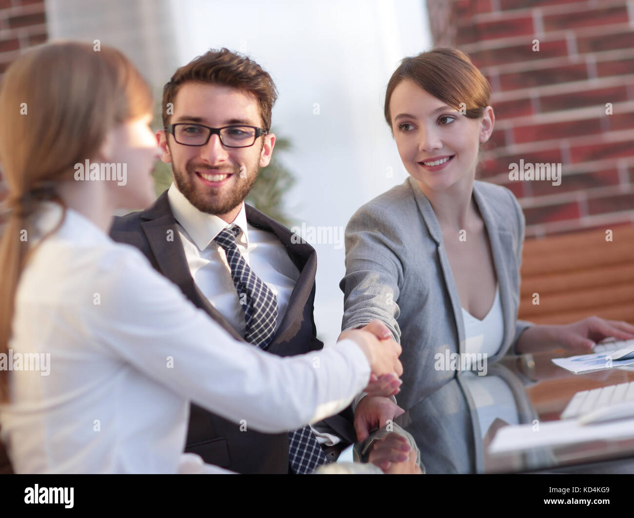 business woman greets the employee with a handshake Stock Photo - Alamy