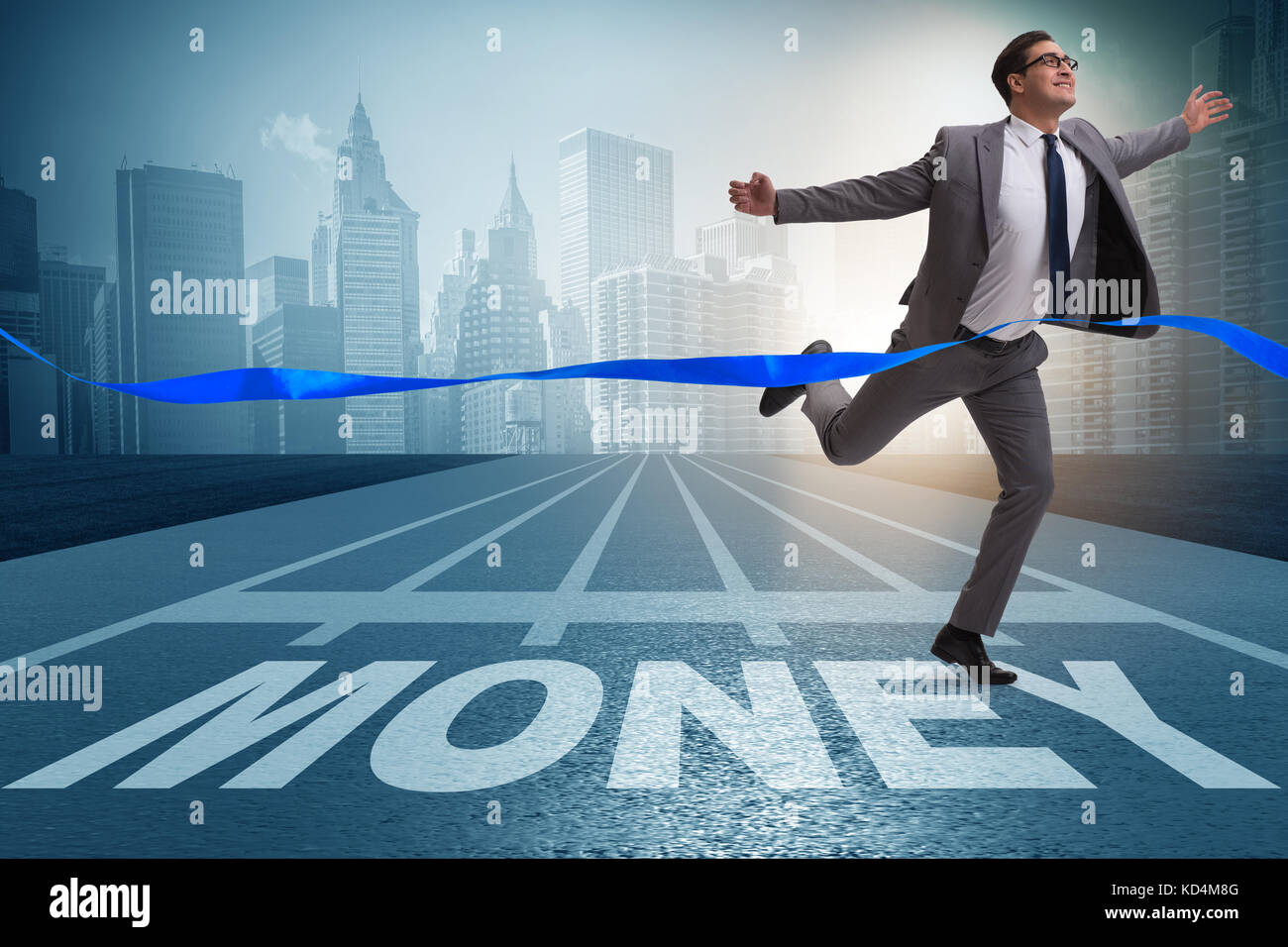 Businessman running towards money on track Stock Photo - Alamy