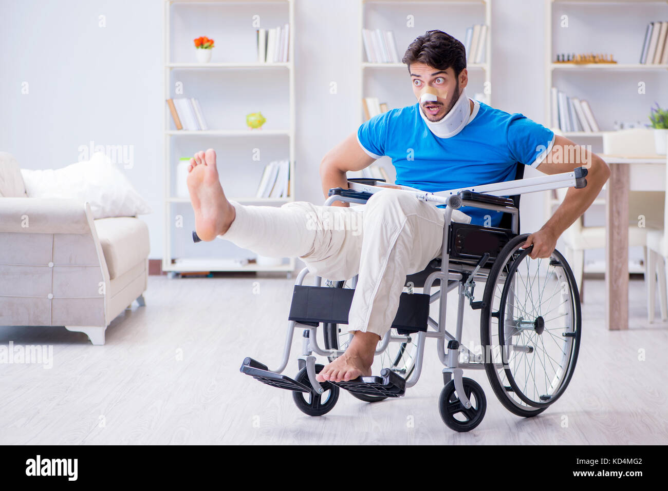 Injured young man recovering at home Stock Photo - Alamy