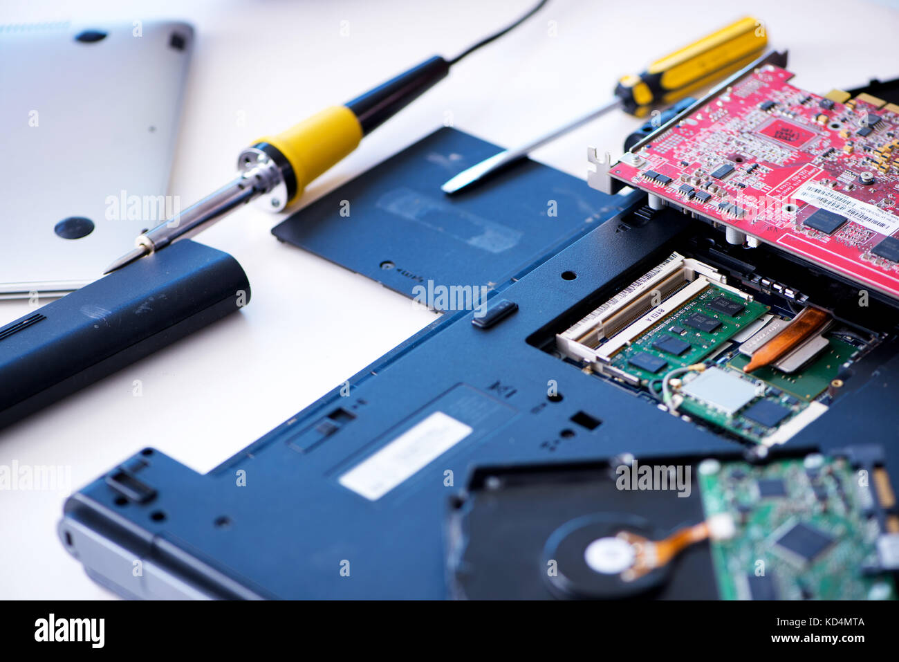 Repairman working in technical support fixing computer laptop ...