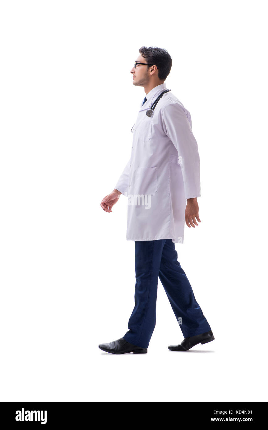 Young doctor physician standing walking isolated on white background ...