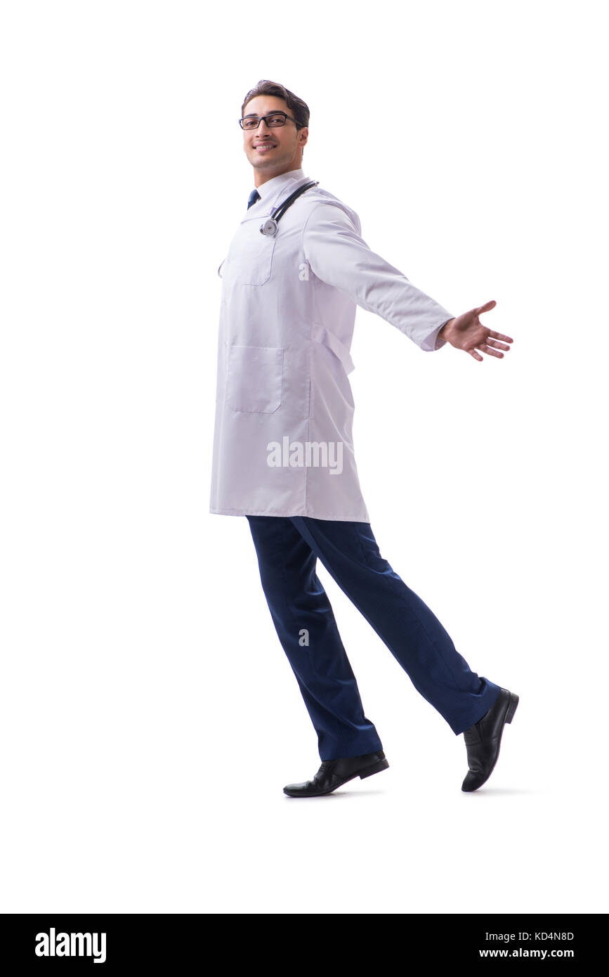 Young doctor physician standing walking isolated on white background ...