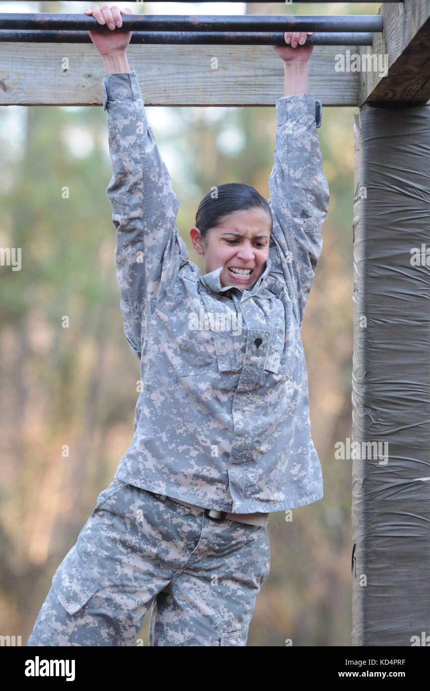 Spc. Andrea Oliveira, 228th Signal Brigade, tries to hold on to the ...