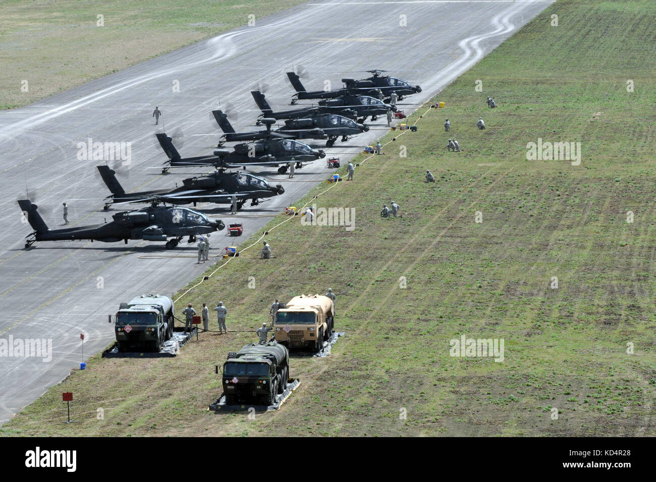 AH-64 Apache helicopters from the 1-151st Attack Reconnaissance ...