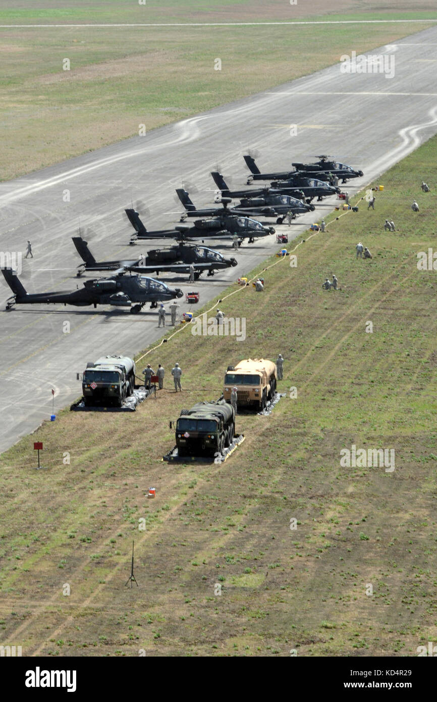 AH-64 Apache helicopters from the 1-151st Attack Reconnaissance ...
