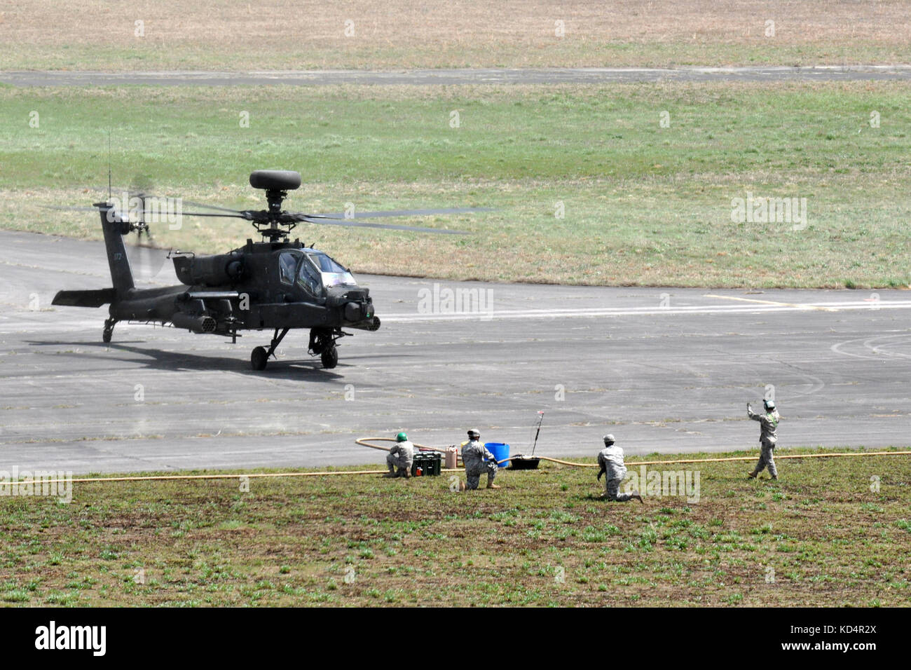 AH-64 Apache helicopters from the 1-151st Attack Reconnaissance ...