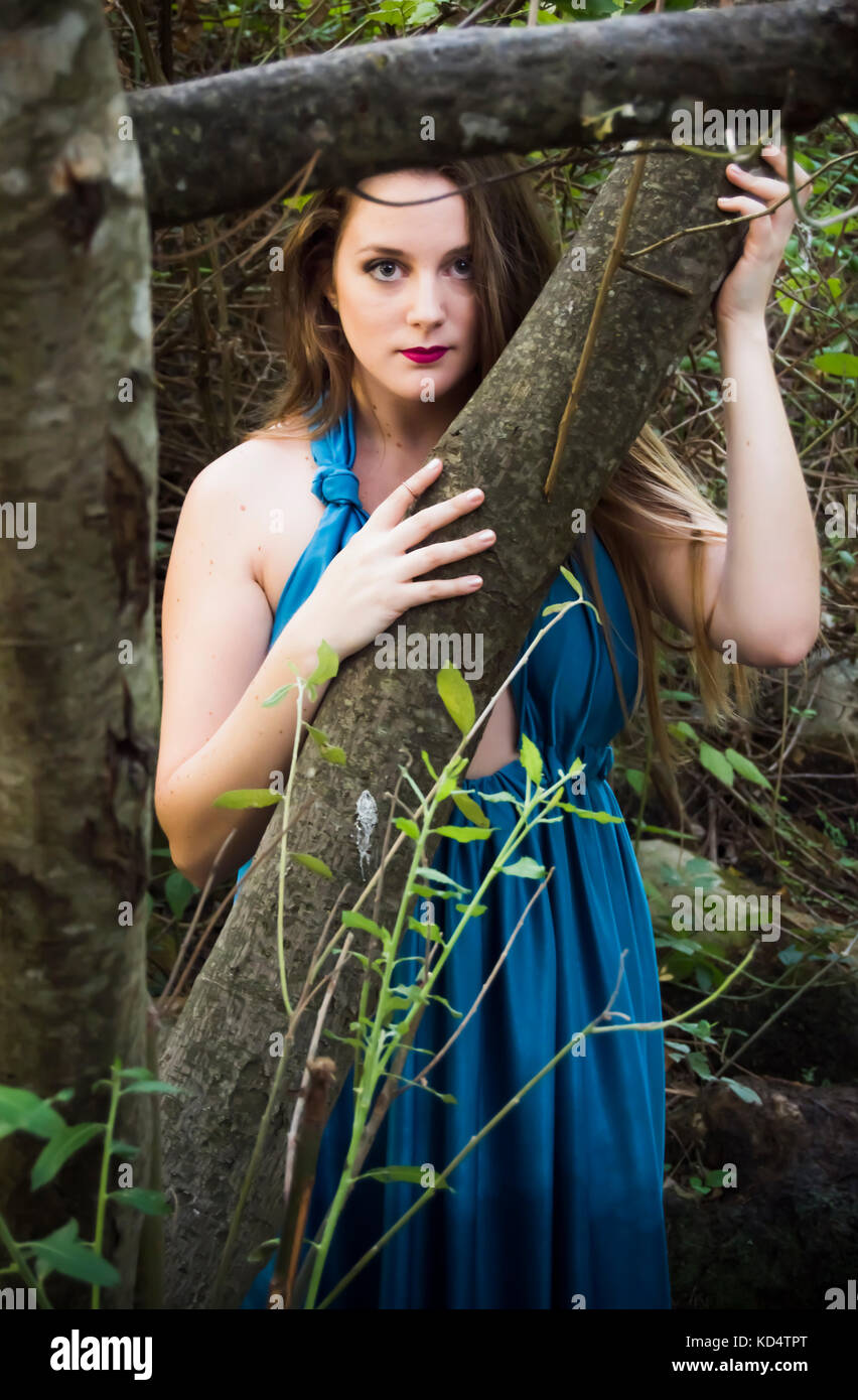 Beautiful woman on forest with an evening dress Stock Photo - Alamy