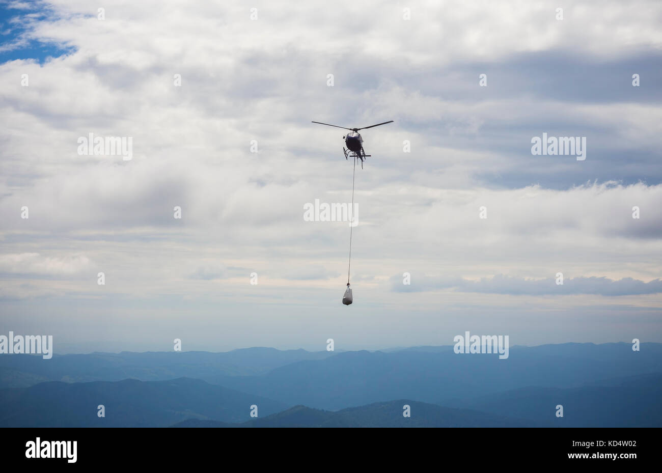 helicopter carry cargo in the sky Stock Photo - Alamy
