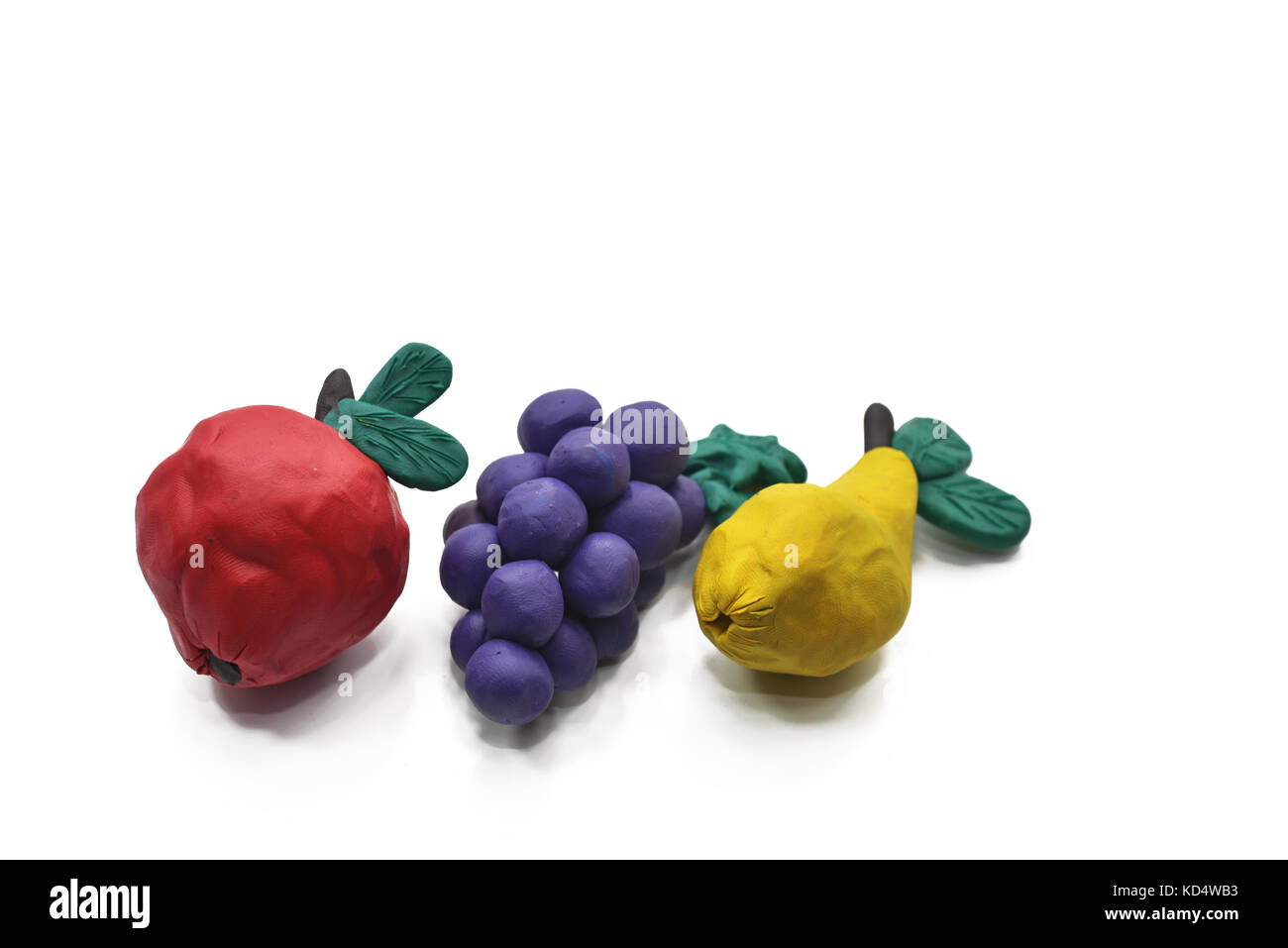 Fruits from plasticine. Isolated on white background Stock Photo - Alamy