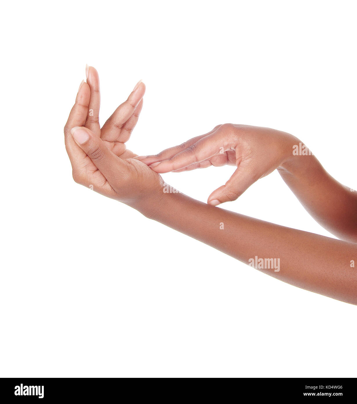 A closeup image of the elegant hands of an African woman over white ...