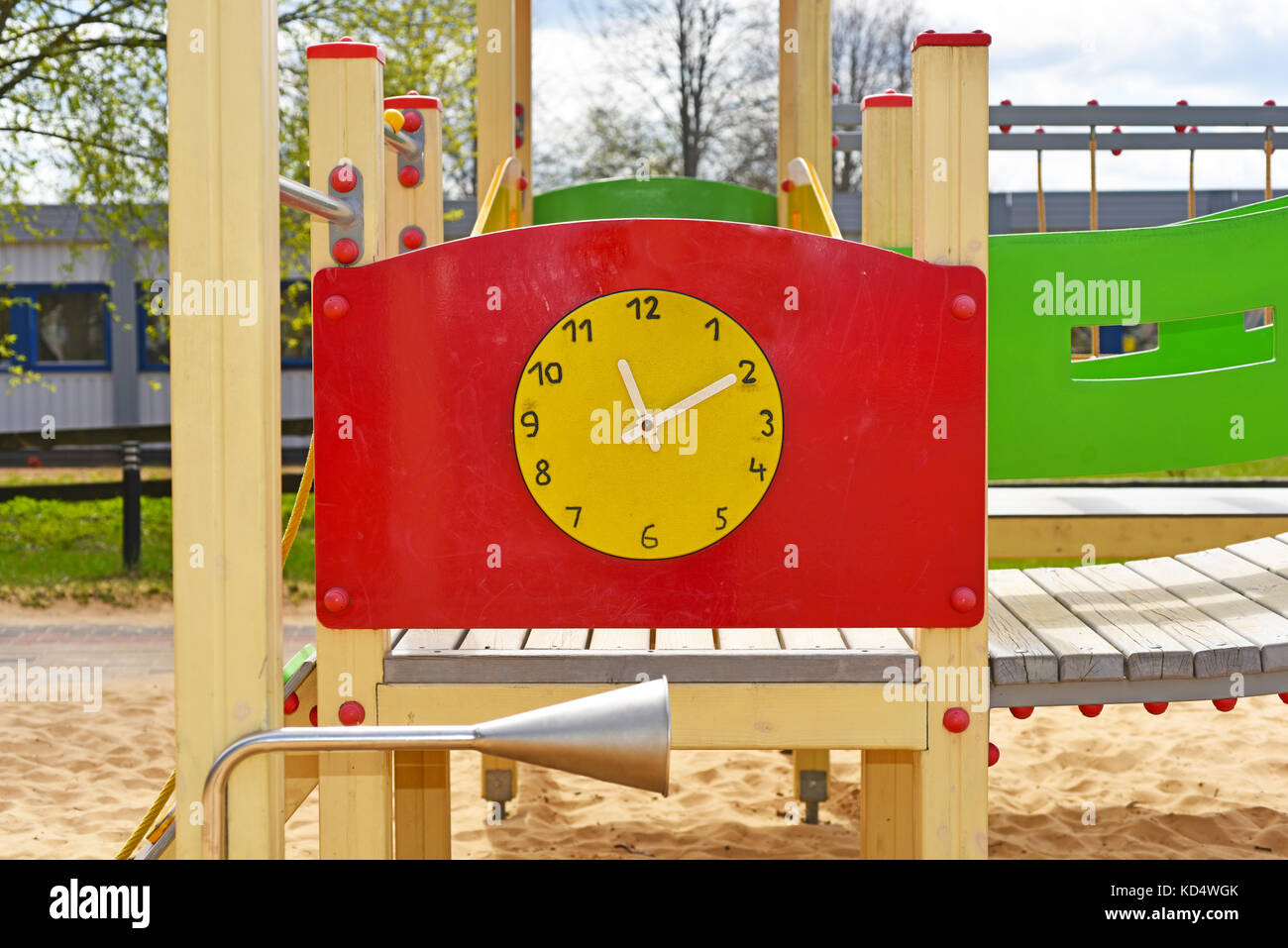 Wooden big yellow clock in children playground. Time abstraction Stock ...