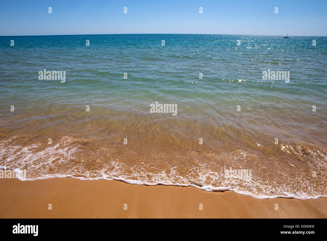 View across the sea from Meia Praia bach in Lagos, the Algarve region ...