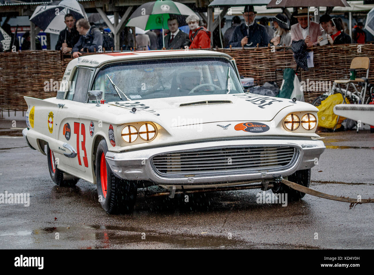 1959 Ford Thunderbird with driver Bill Shepherd is towed through parc ...