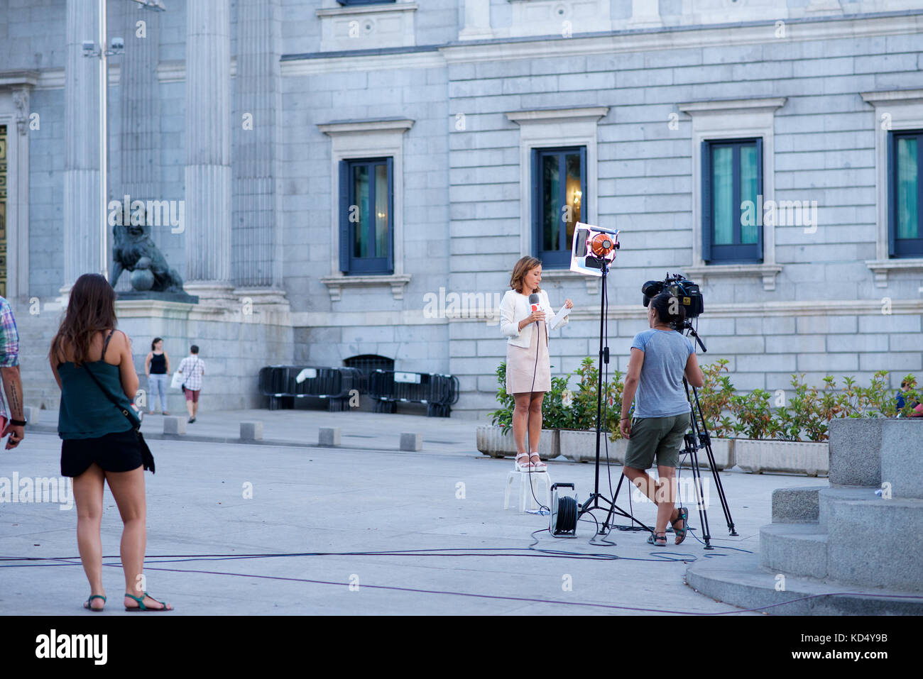 A news reporter and cameraman on the streets of Madrid, Spain Stock ...