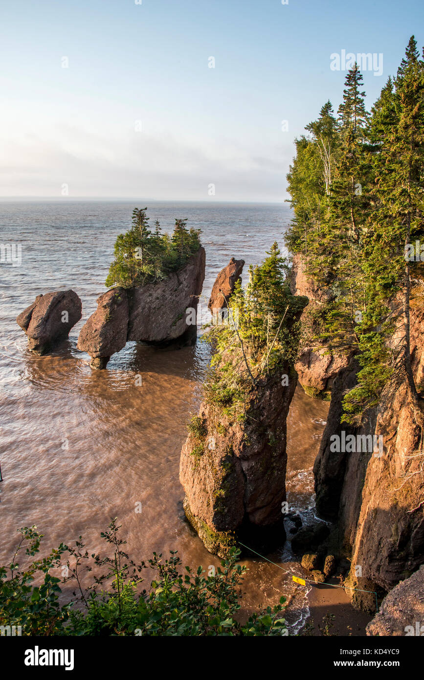 Sunrise at famous Hopewell Rocks geologigal formations at low tide ...