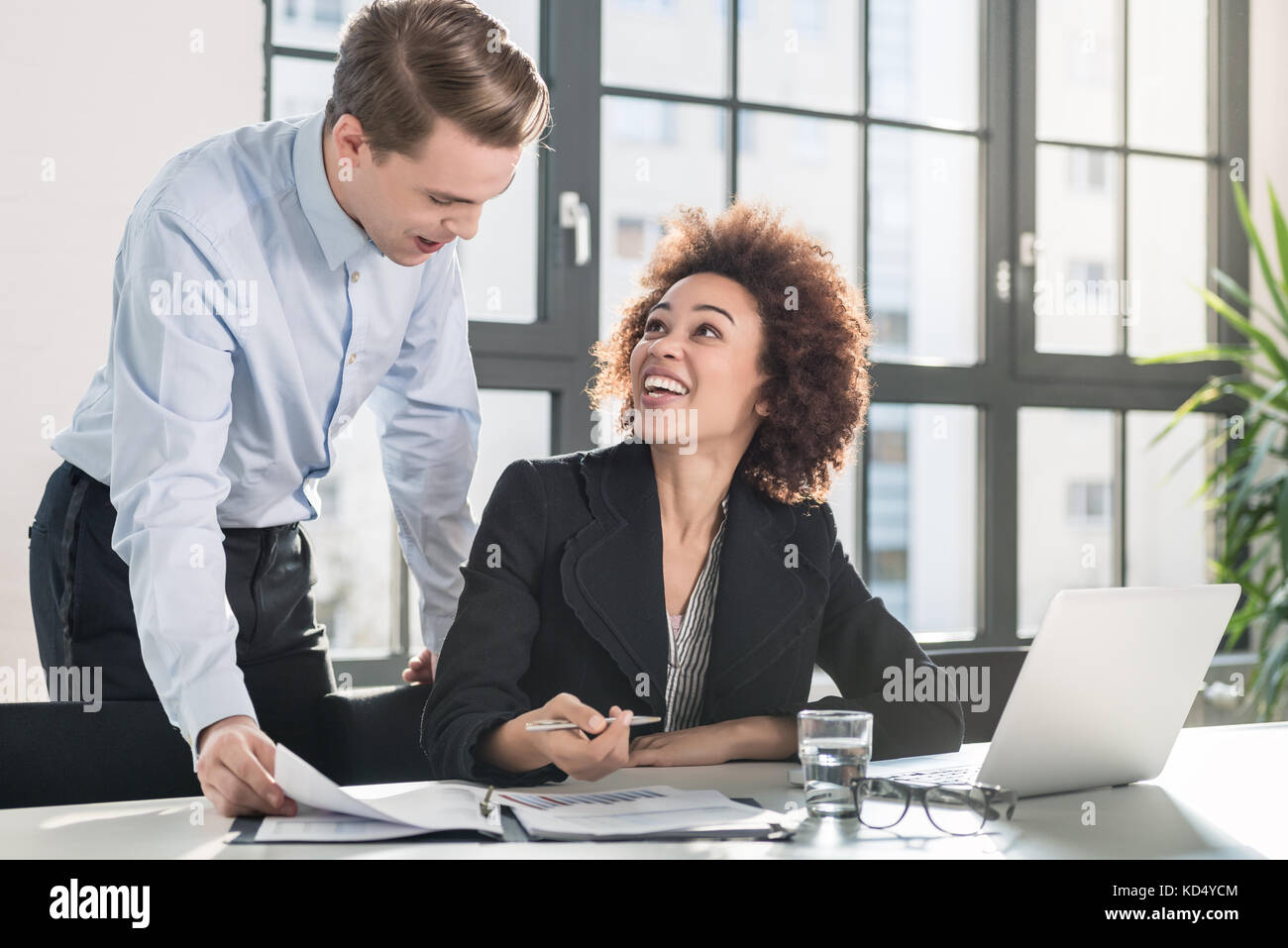Supervisor checking statistics and explaining the results Stock Photo ...