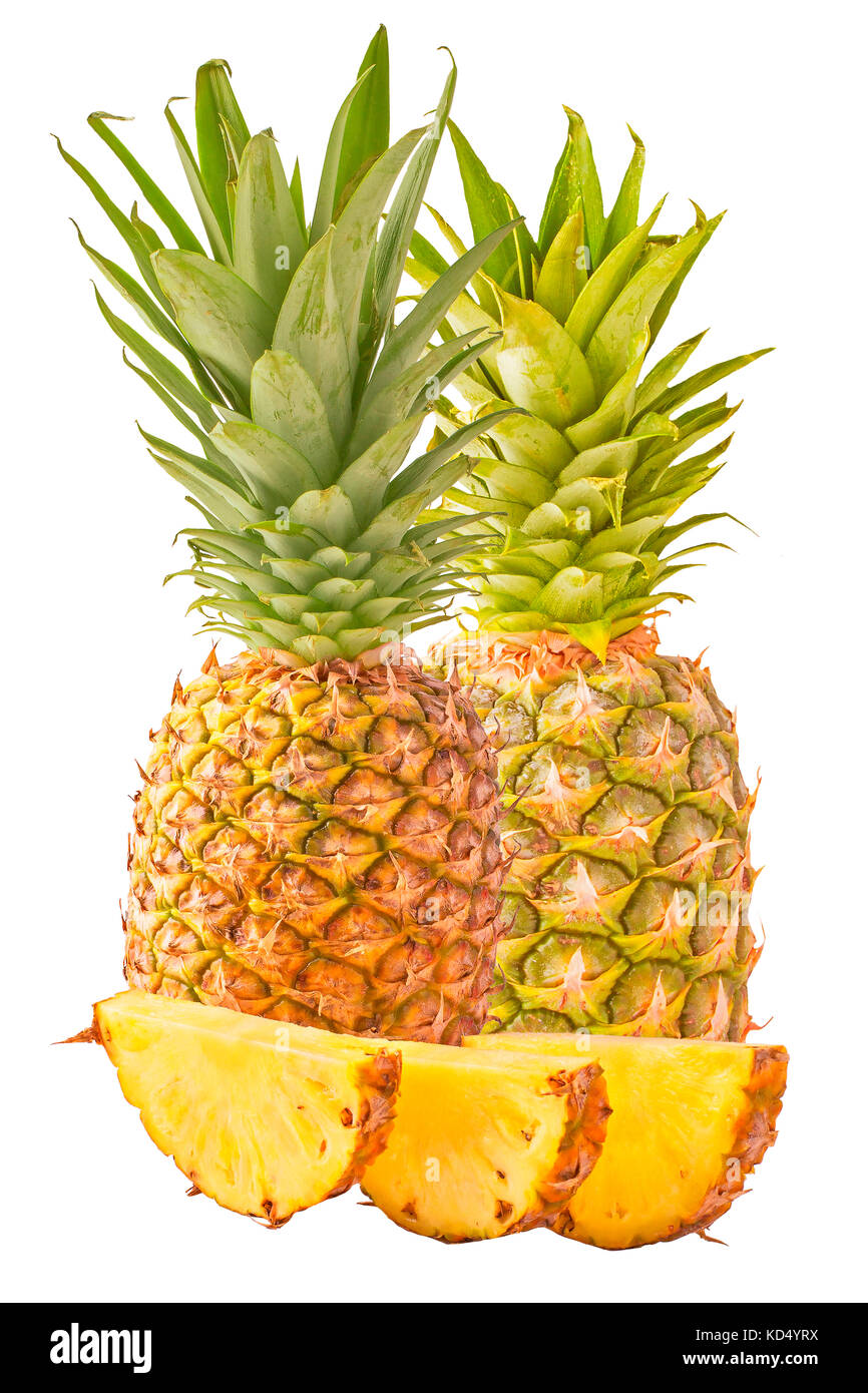 Isolated tropical fruits. Two pineapple with slices isolated on white ...