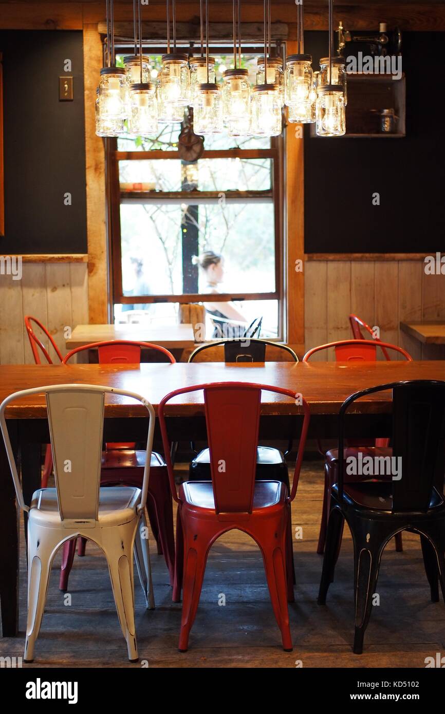 Interior of the Chelsea Pub showing light fixture, table and chairs ...