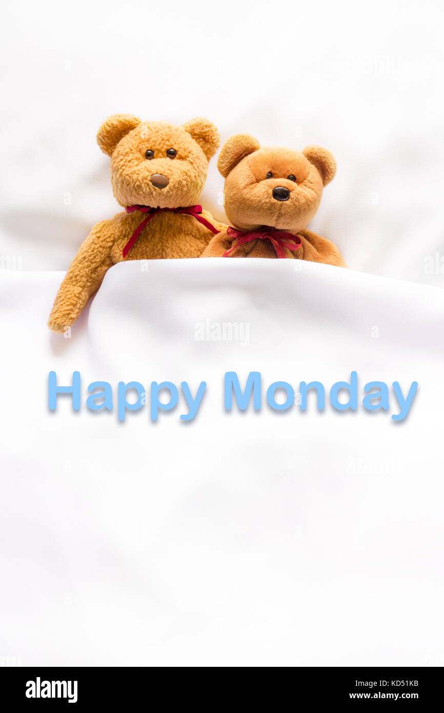 Teddy Bear lying in the white bed with message " Happy Monday Stock ...