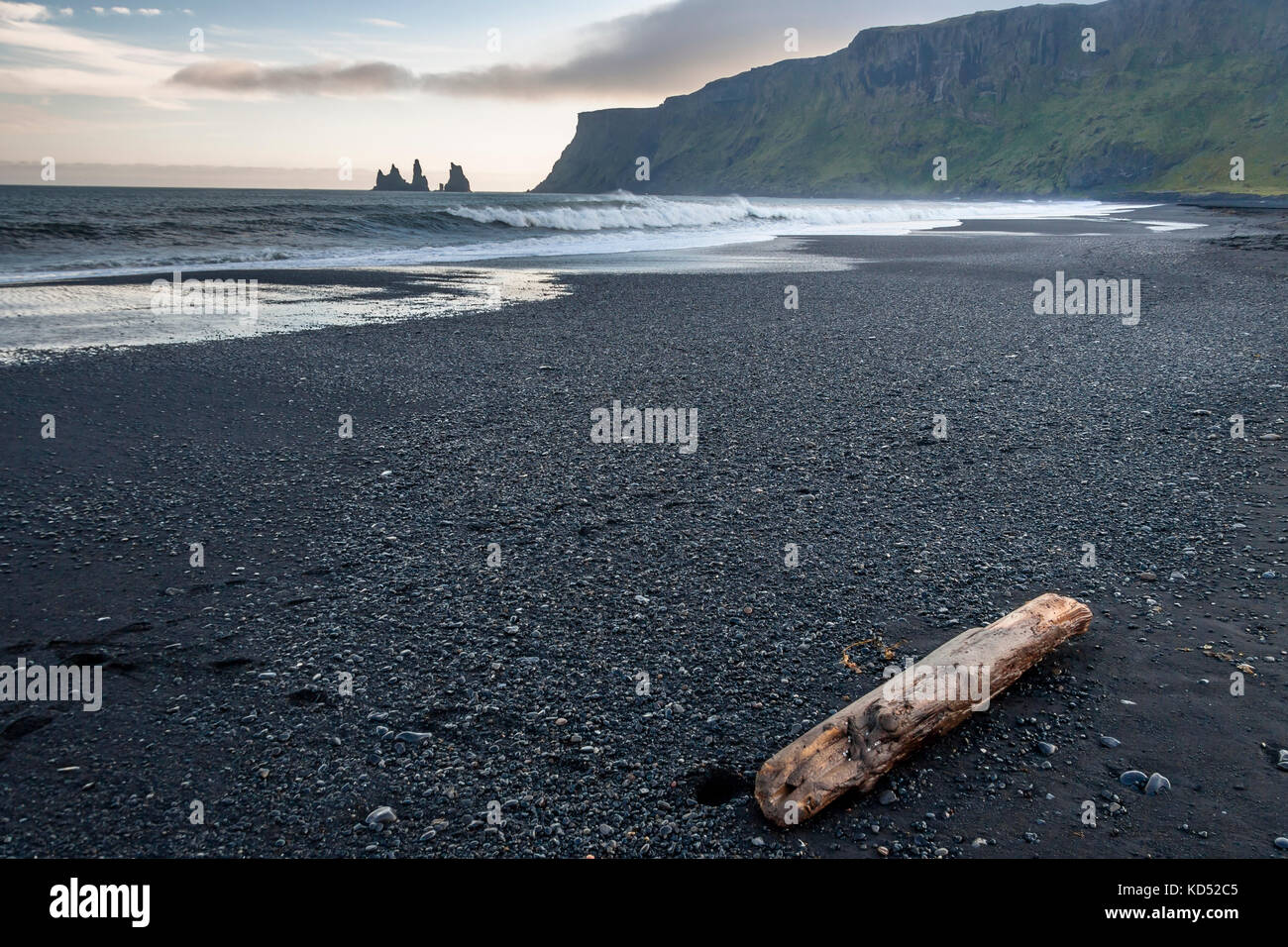 Reynisdrangar rock formations and the mount Reynisfjall. Black beach in ...