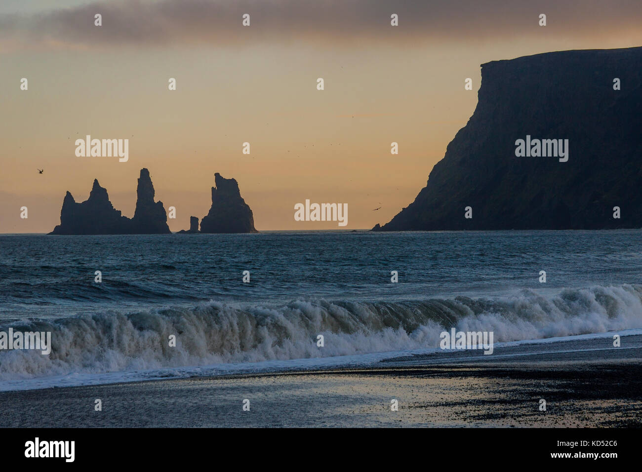 Reynisdrangar rock formations and the mount Reynisfjall. Black beach in ...