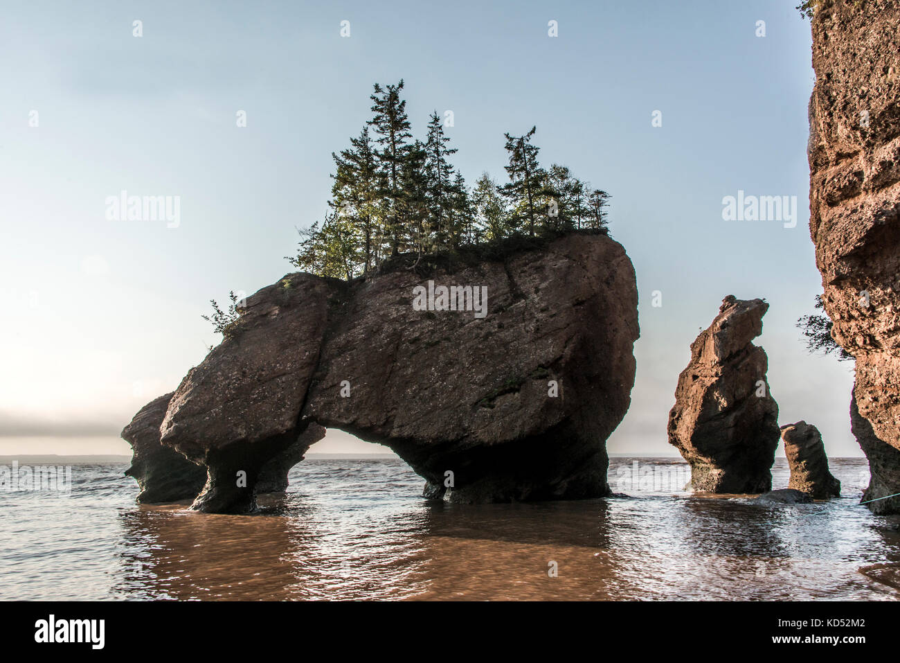 Sunrise at famous Hopewell Rocks geologigal formations at low tide ...