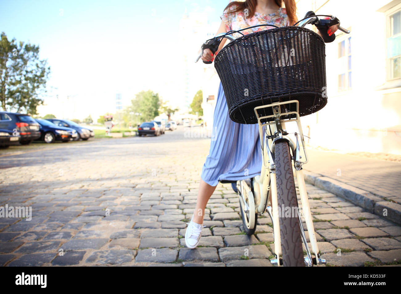 Young beautiful, elegantly dressed woman with bicycle. Beauty, fashion ...