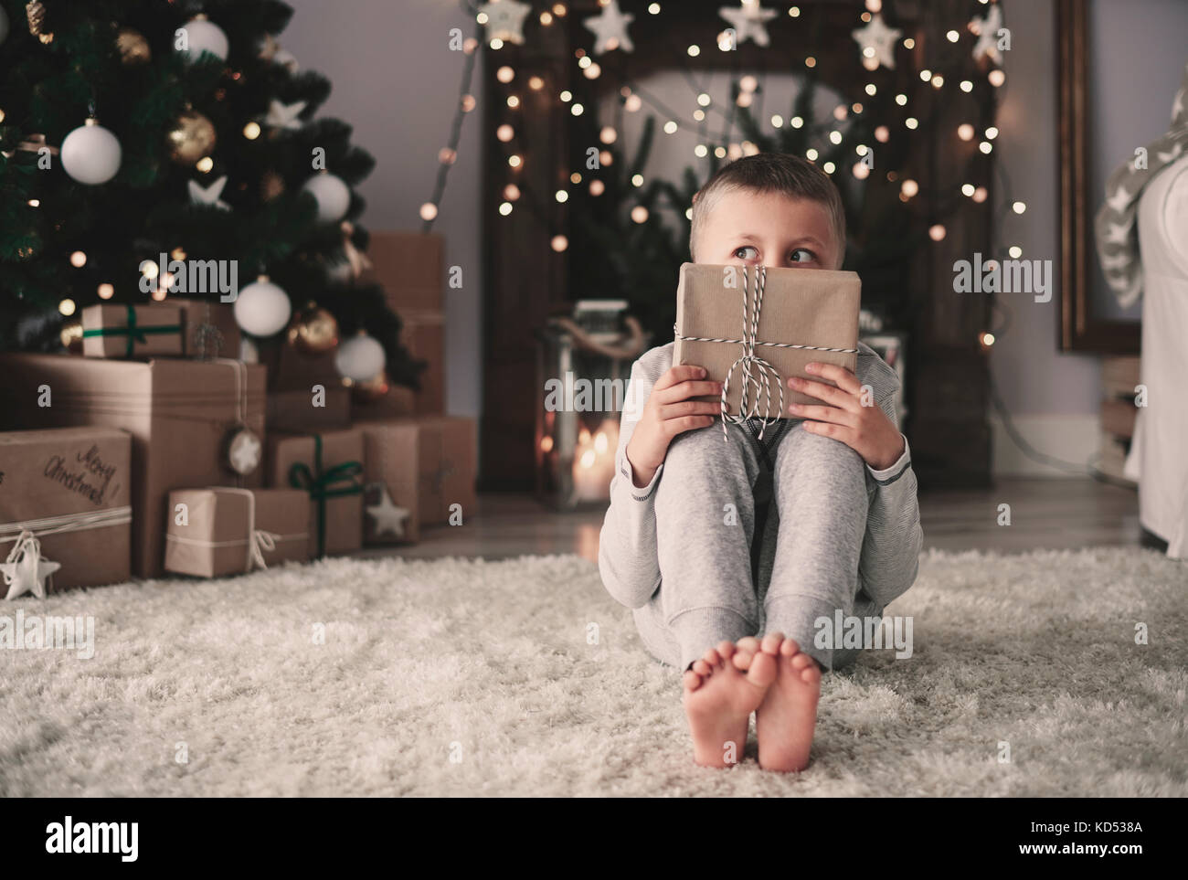 Boy with his christmas present Stock Photo - Alamy