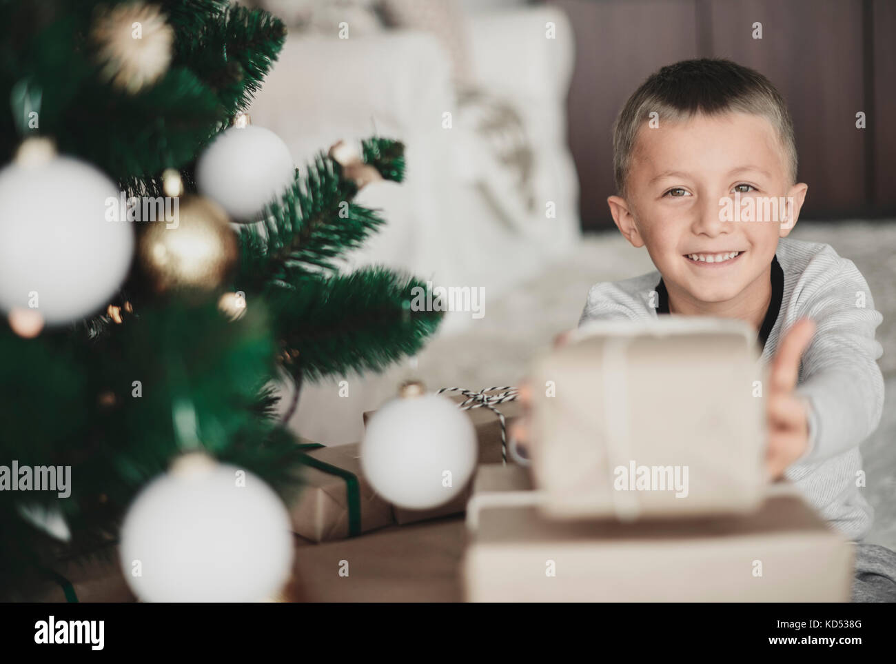 Boy passing present hi-res stock photography and images - Alamy