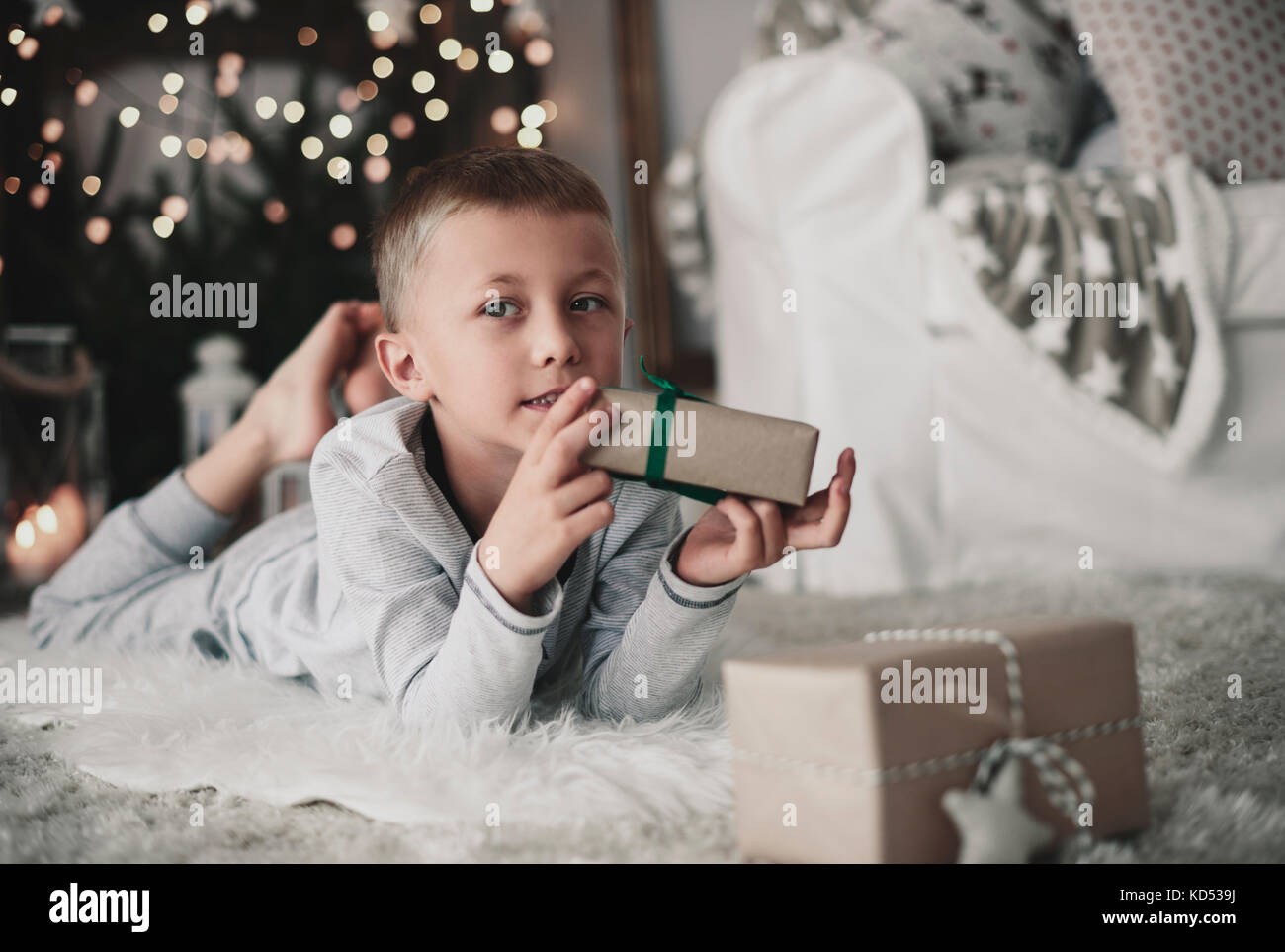 Boy lying on front and dreaming Stock Photo - Alamy