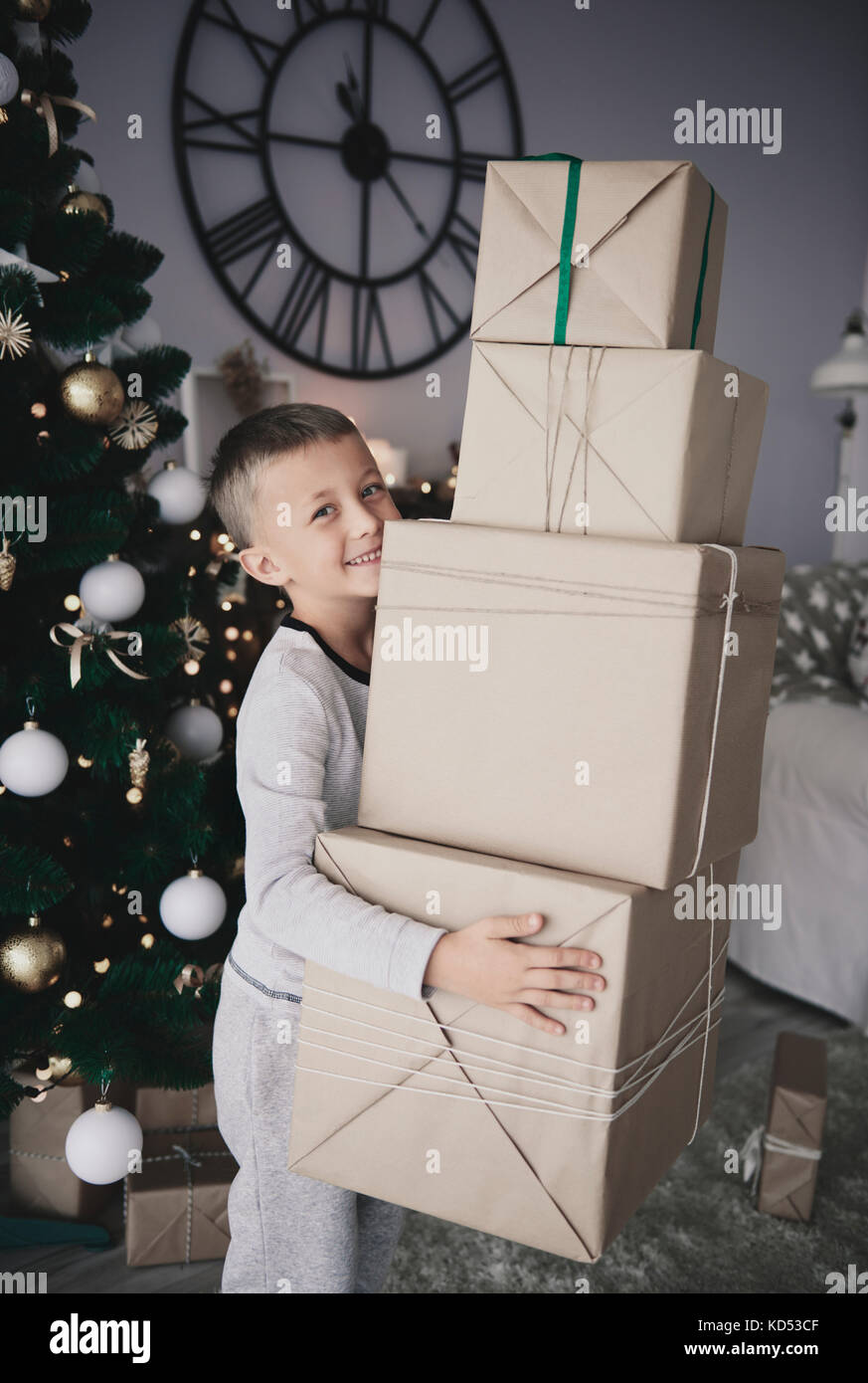 Boy carrying gifts hi-res stock photography and images - Alamy