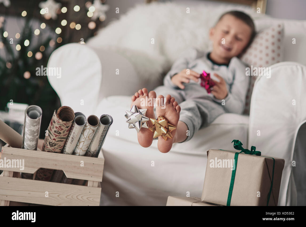 Barefoot human feet with bow Stock Photo - Alamy