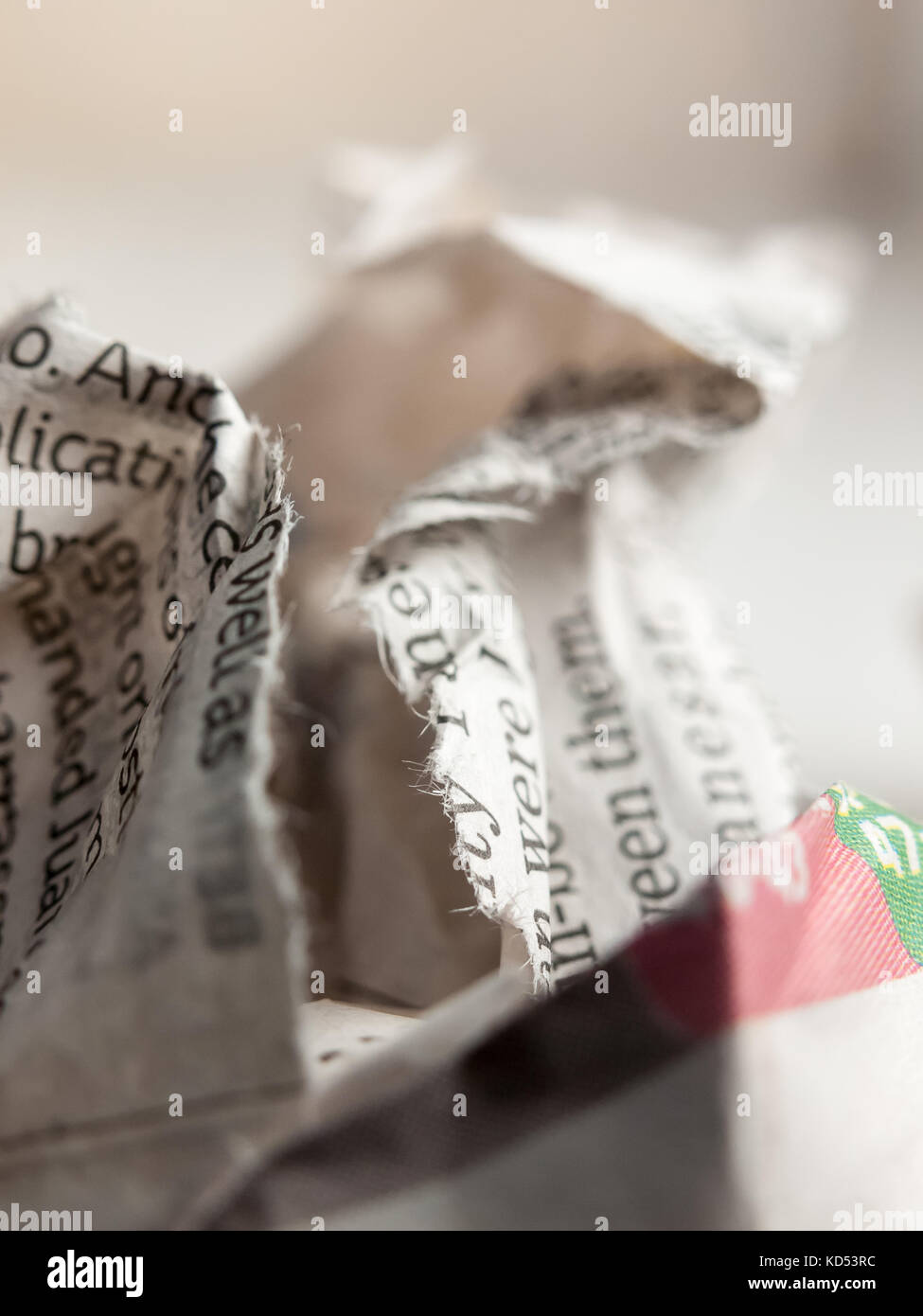close up of crumpled up newspaper studio macro; essex; england; uk ...