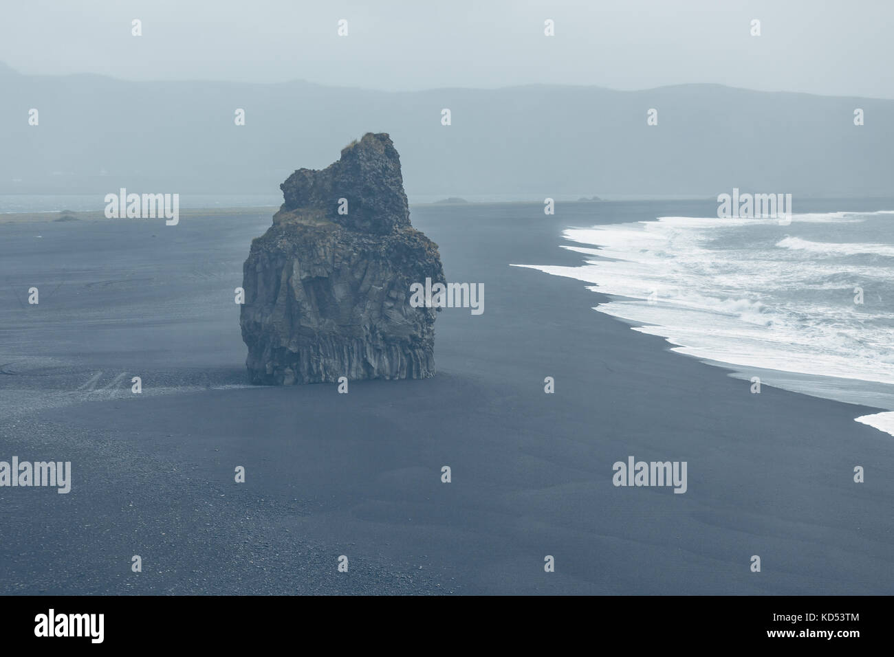 Rock formation on black volcanic beach at cape Dyrholaey in the ...