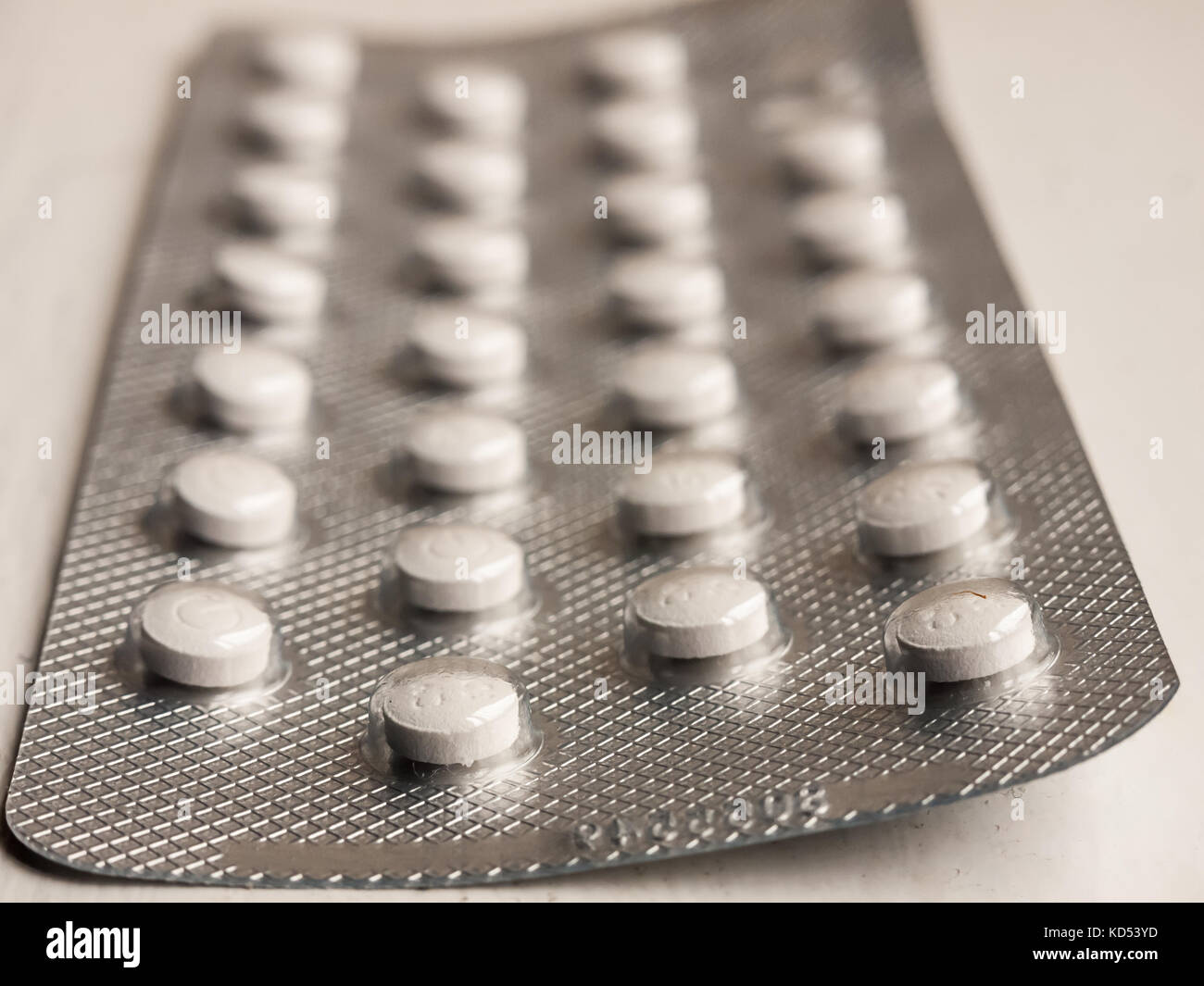 macro of full packet foil of white tablets healthcare; essex; england ...