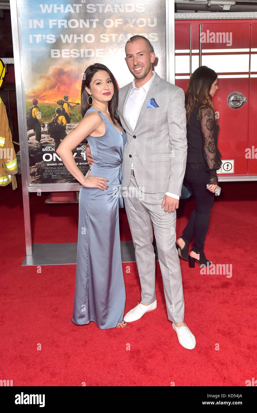 Sam Quinn and guest attend the 'Only the Brave' premiere at Regency ...
