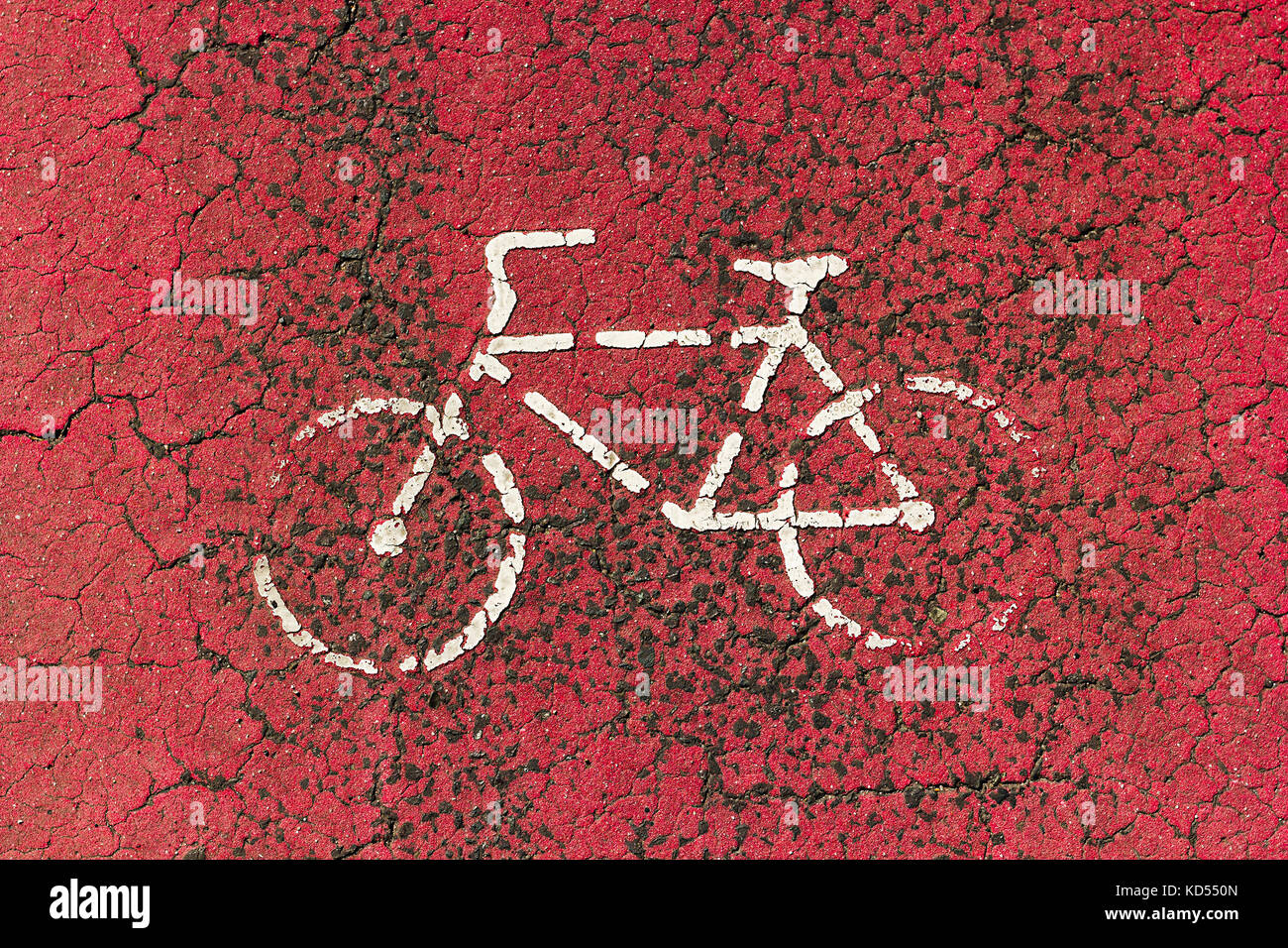 Bike lane sign drawn in white on red bike lane Stock Photo - Alamy