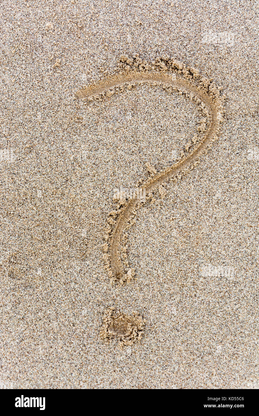 A question mark drawn in the sand from above Stock Photo - Alamy