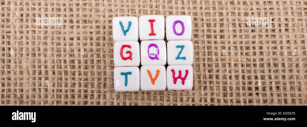 Colorful alphabet letter cubes on a linen canvas Stock Photo - Alamy