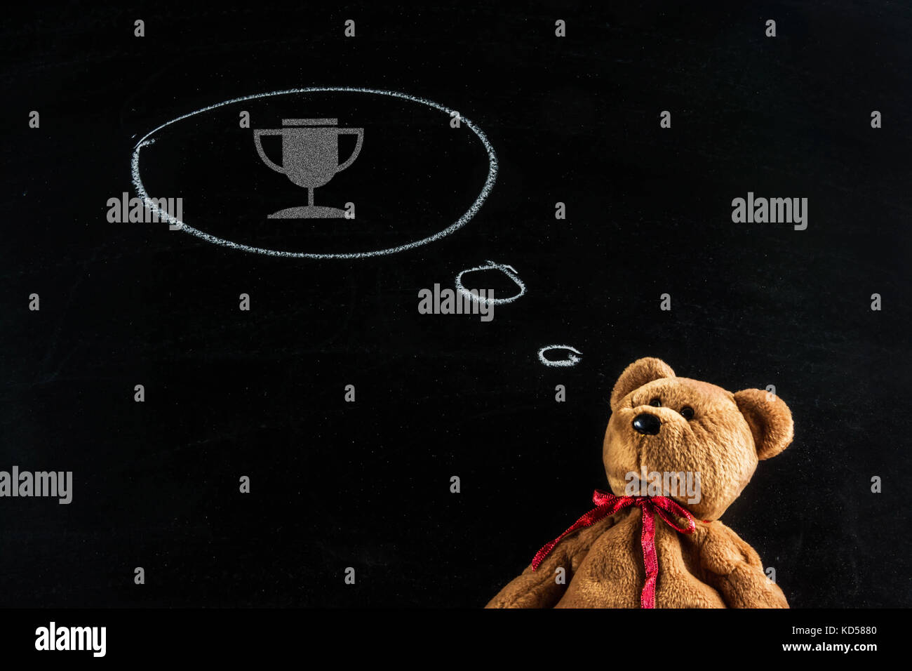 The dream of a teddy bear . Teddy bear with trophy icon Stock Photo - Alamy