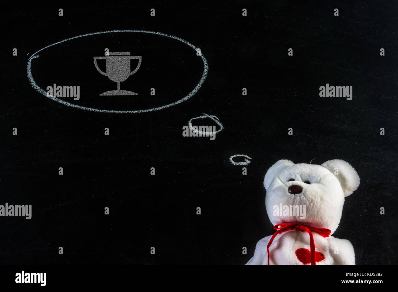 The dream of a teddy bear . Teddy bear with trophy icon Stock Photo - Alamy