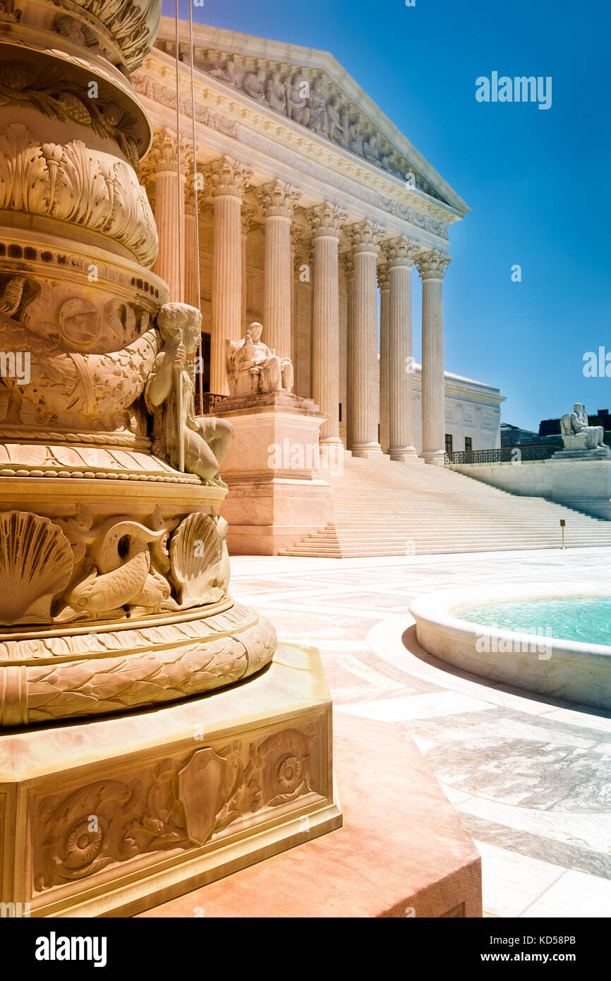 Washington DC Supreme Court exterior. View framed by an ornate flag ...