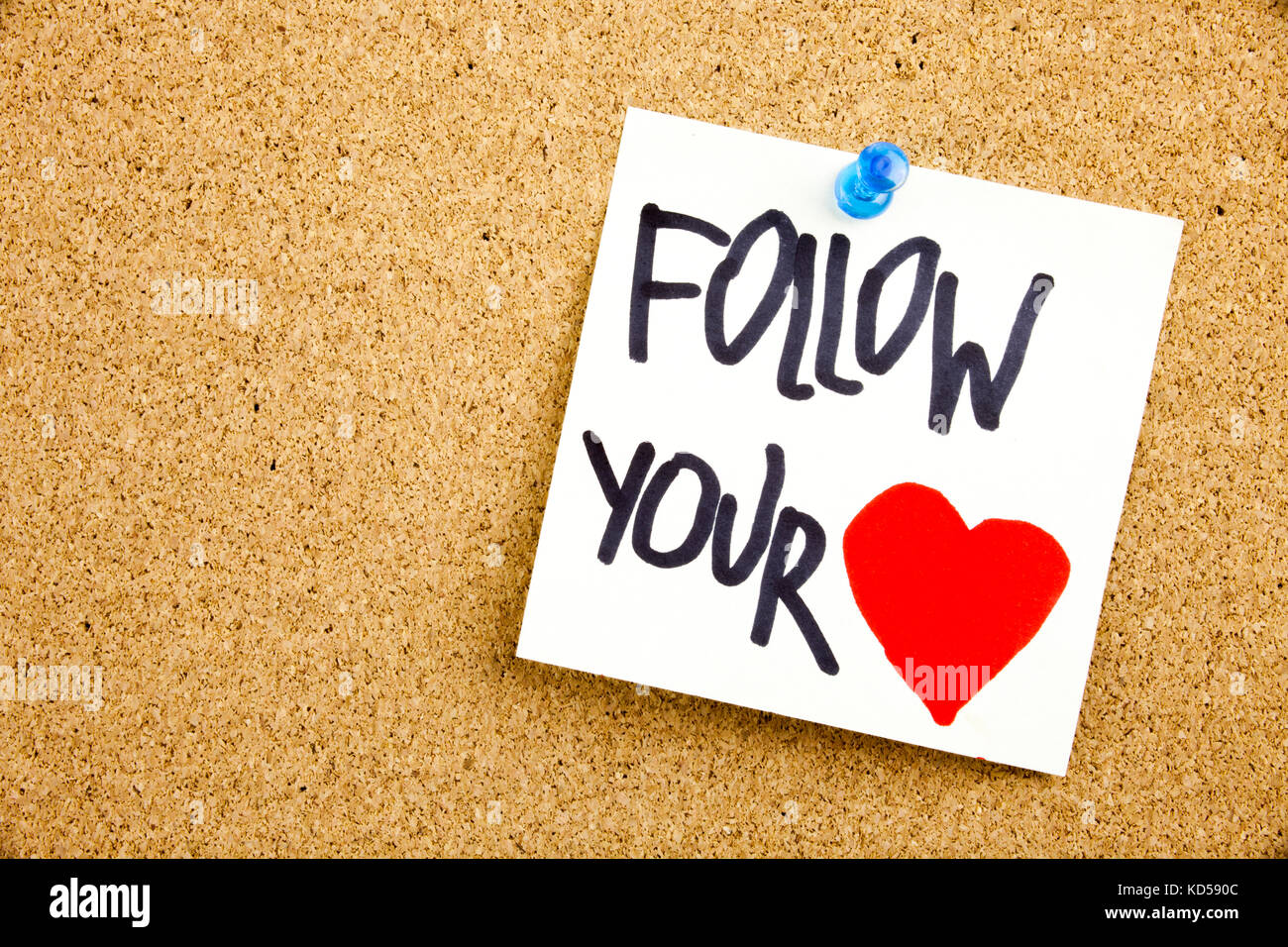 A yellow sticky note writing, caption, inscription Phrase FOLLOW YOUR ...