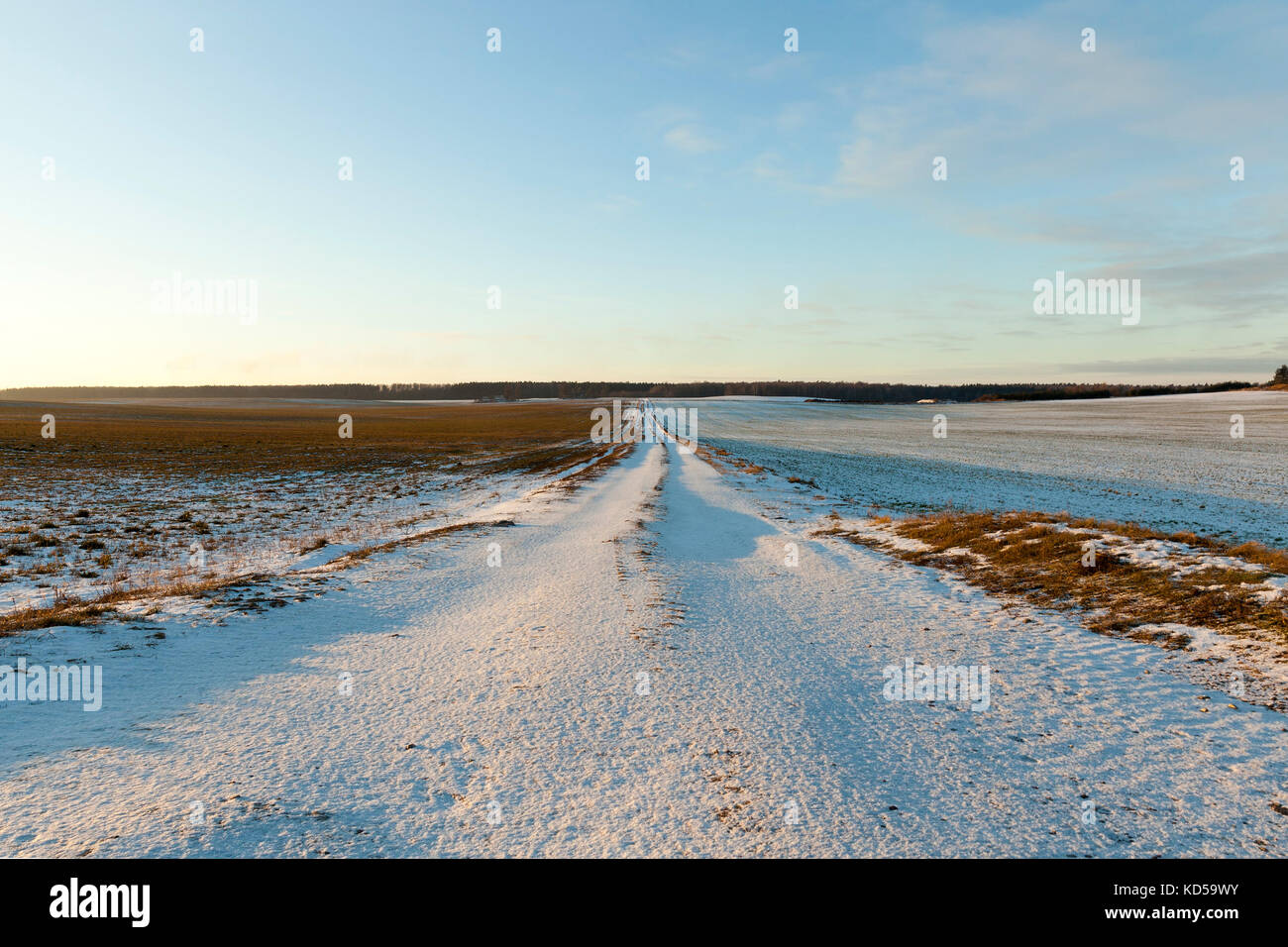 Ruts on a snow-covered road Stock Photo - Alamy