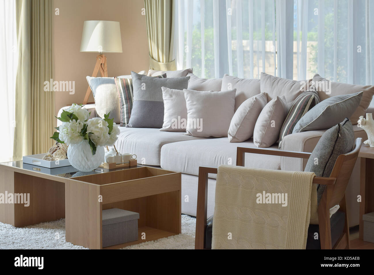 modern living room design with sofa and wooden lamp Stock Photo - Alamy