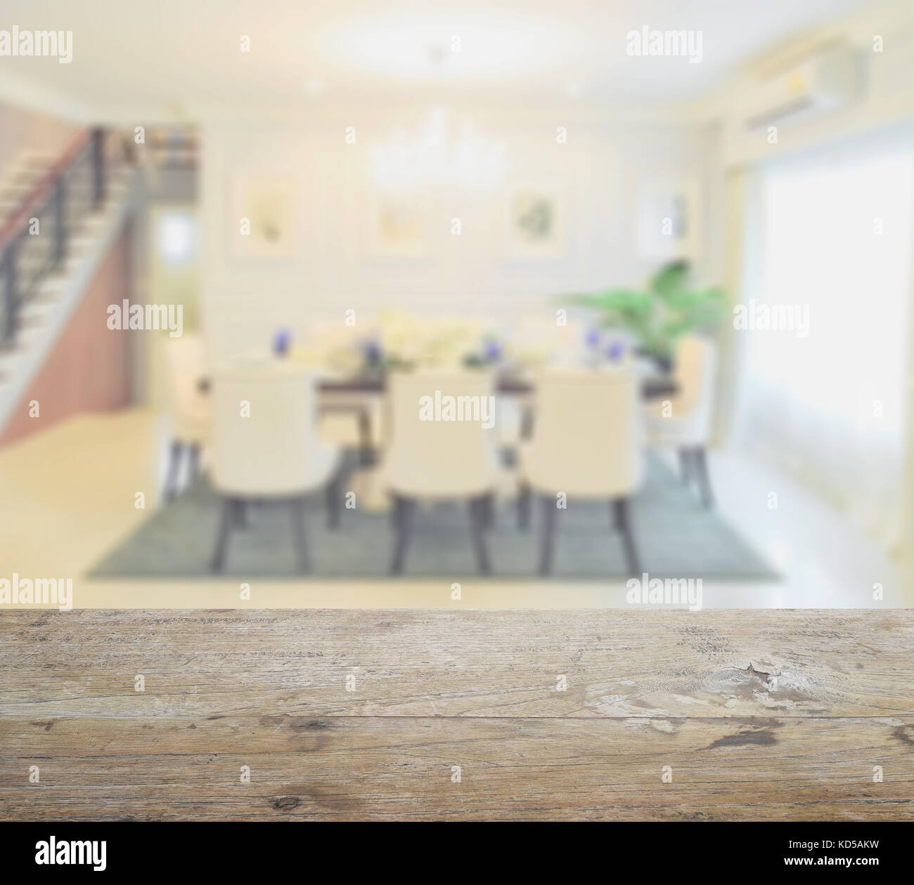 wooden table top with blur of classic style dining table in the dining ...