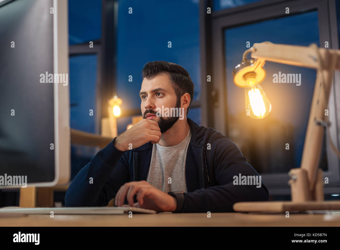Serious male person working in the office Stock Photo - Alamy