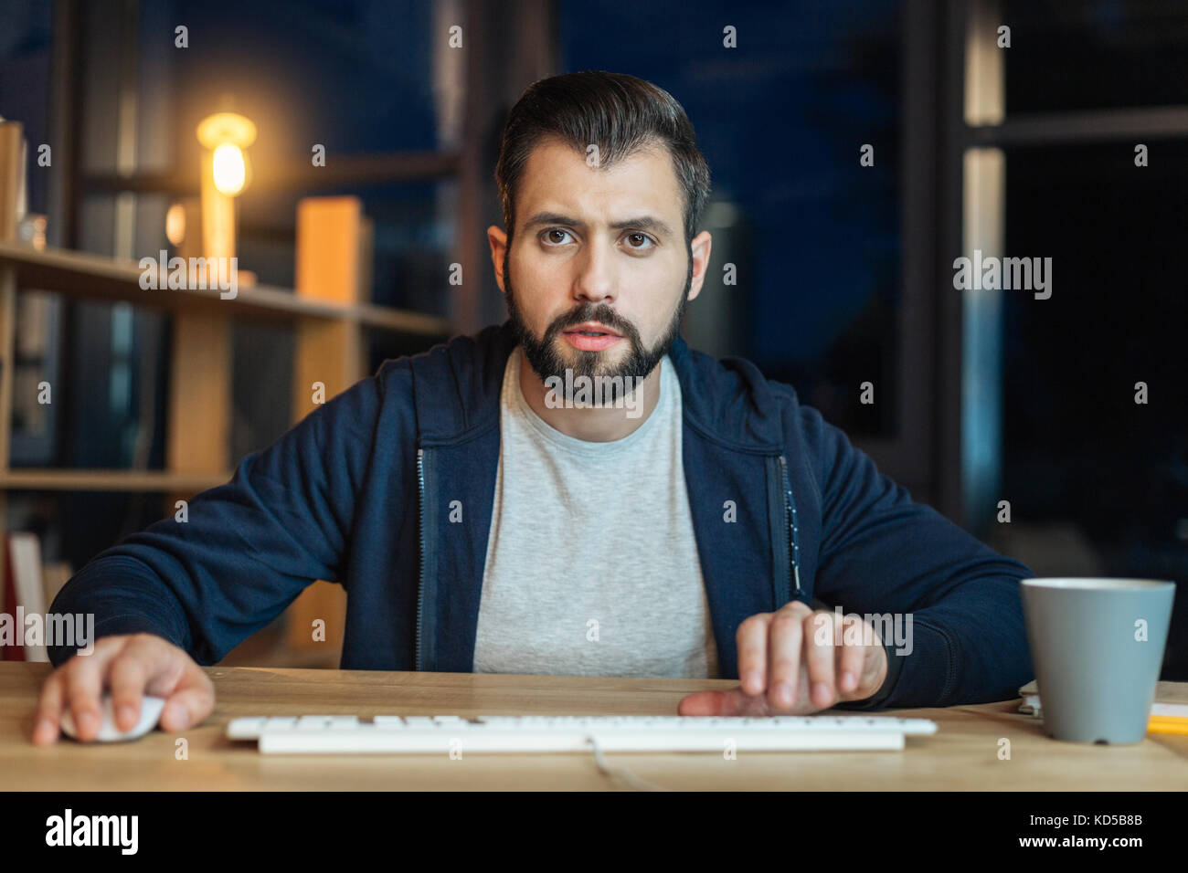 Portrait of handsome male person while working Stock Photo - Alamy