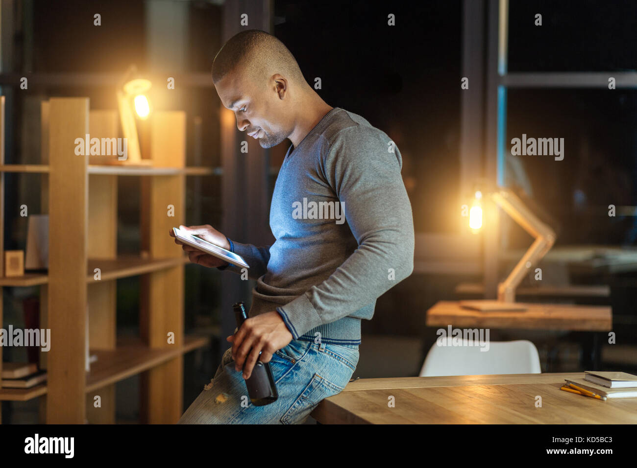 Profile photo of serious man that watching video Stock Photo - Alamy